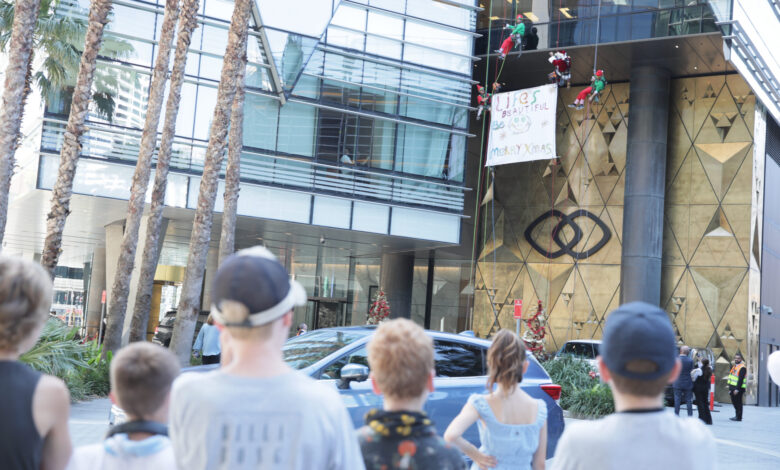 Santa abseils down Sofitel Sydney Darling Harbour to bring presents to ...